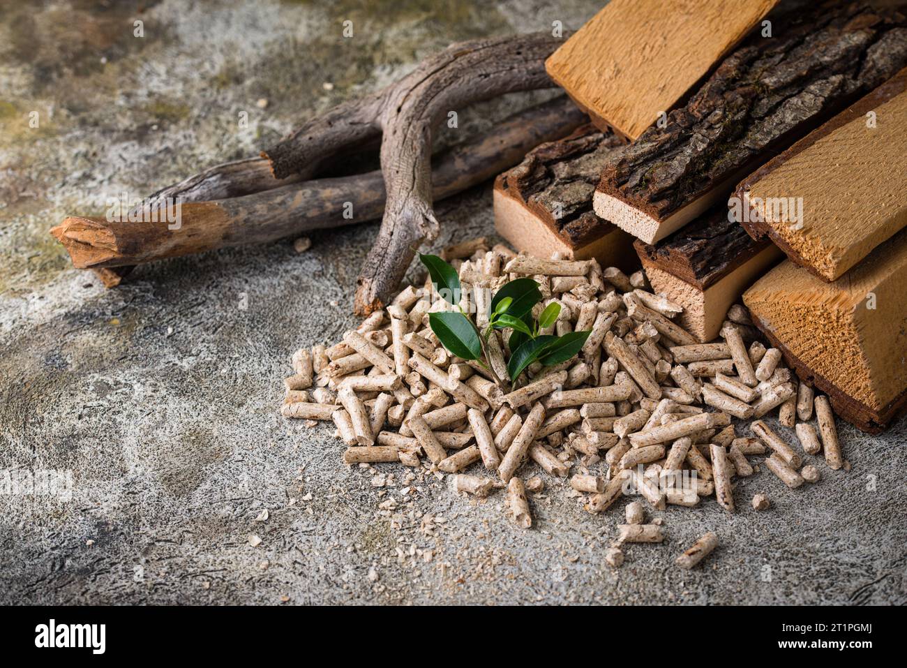 Eco fuel wooden pellets with firewood Stock Photo - Alamy