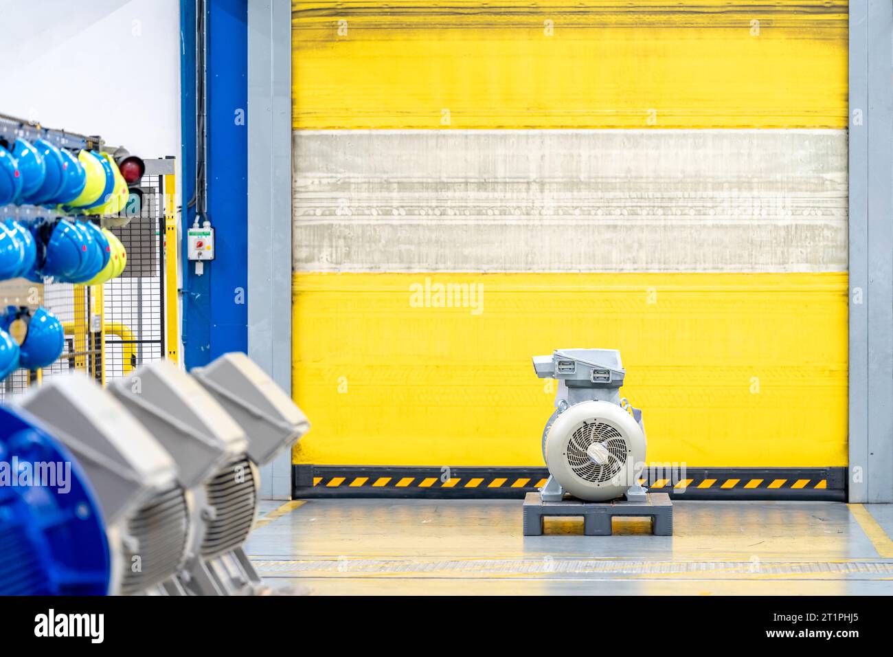 new modern electric motor on pallet in the warehouse on factory, copy ...