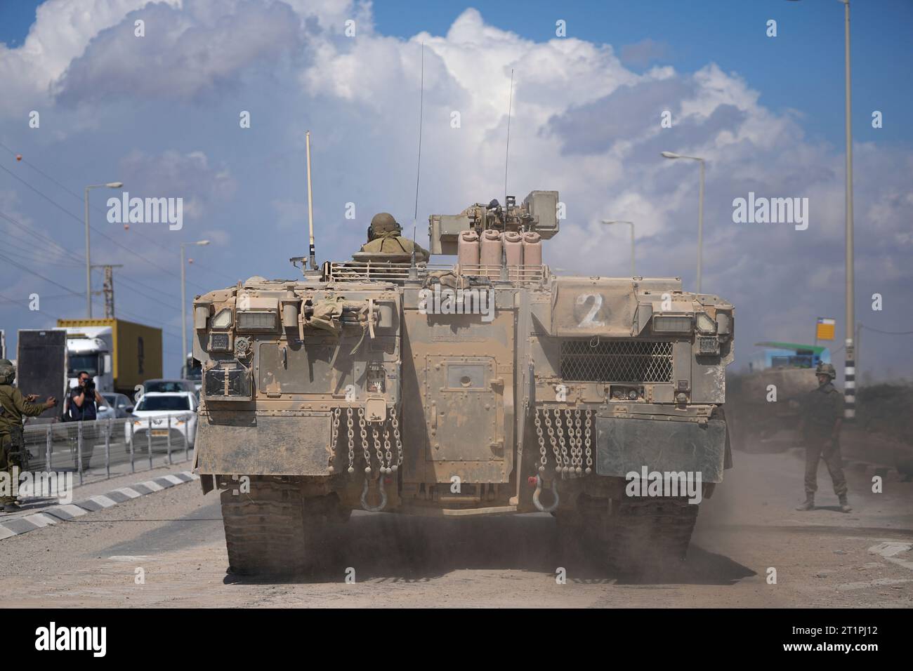 An Israeli armoured personnel carrier (APC) heads towards the Gaza ...
