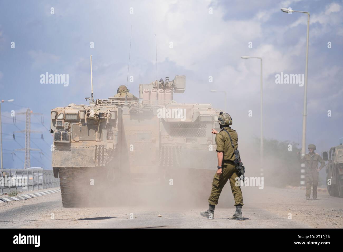 An Israeli armoured personnel carrier (APC) heads towards the Gaza ...