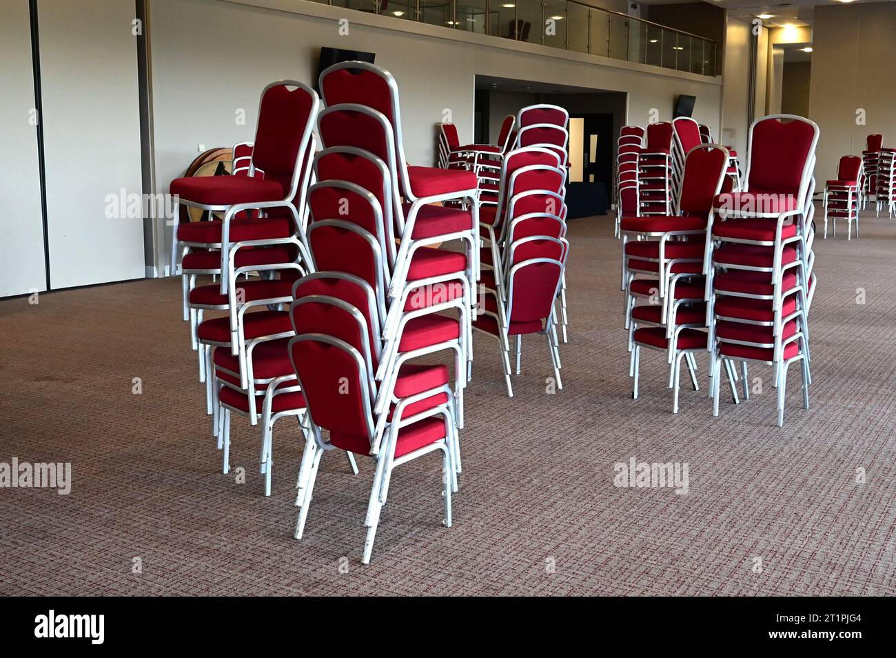 Stacked chairs in a function room in the UK Stock Photo - Alamy