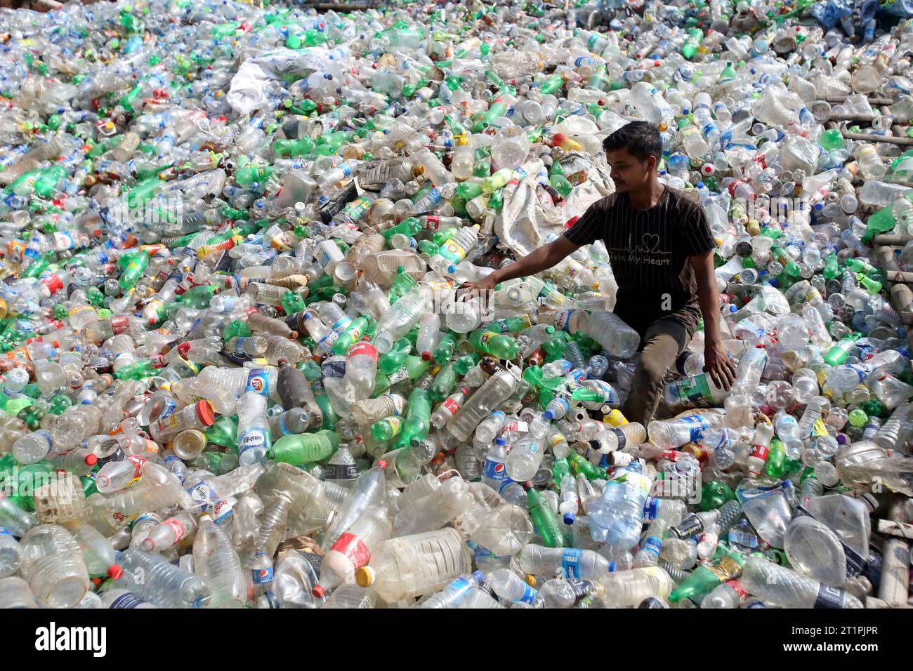 Dhaka, Wari, Bangladesh. 14th Oct, 2023. Employees recycling empty pet bottles to be reused ...