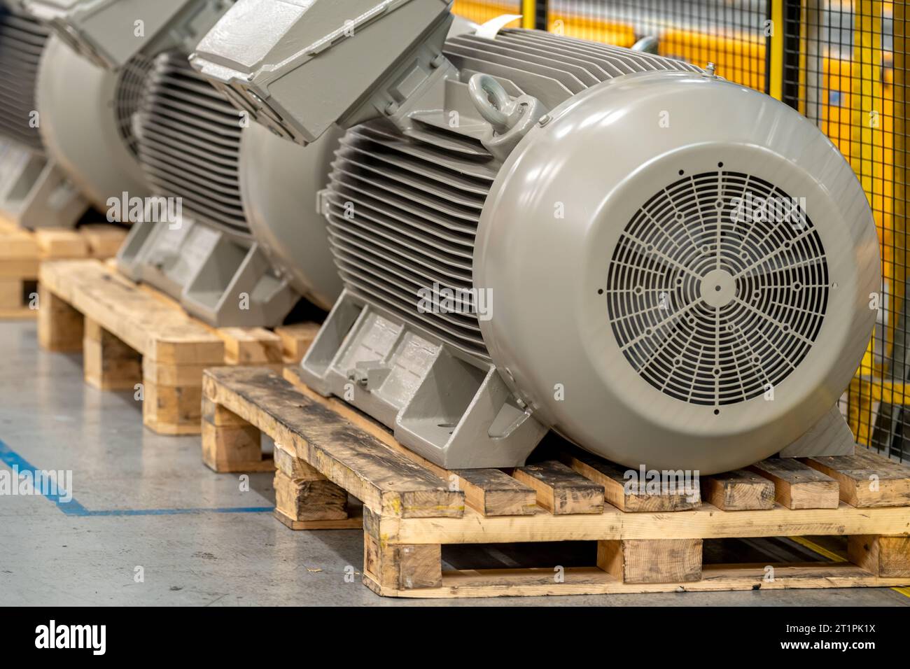 modern grey electric motors on pallets in the warehouse in factory ...