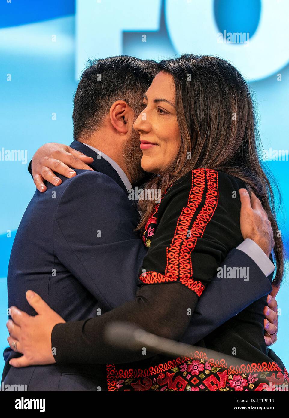 First Minister and SNP leader Humza Yousaf embraces his wife councillor ...