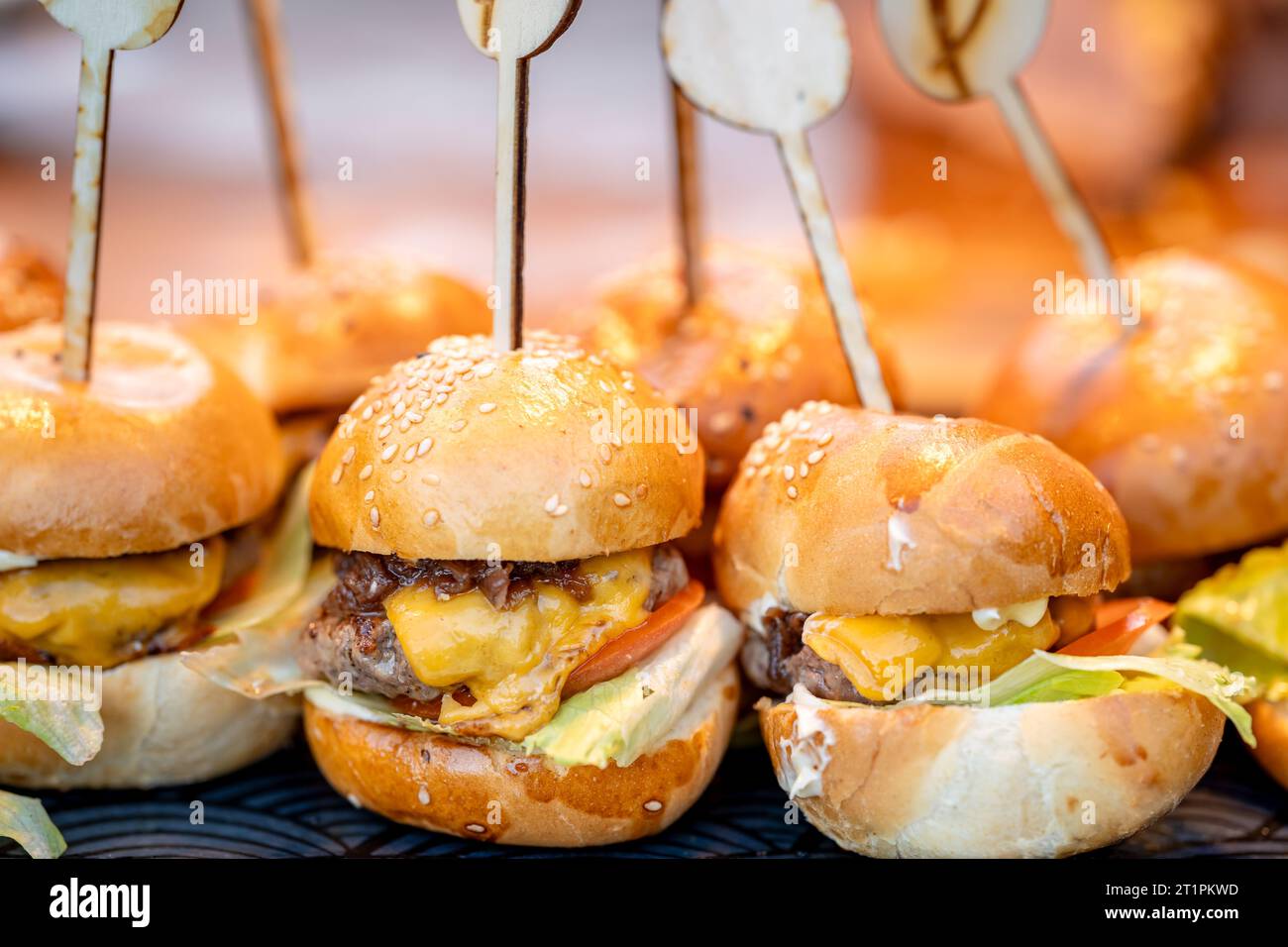Fresh juicy mini burgers on the banquet table Stock Photo - Alamy