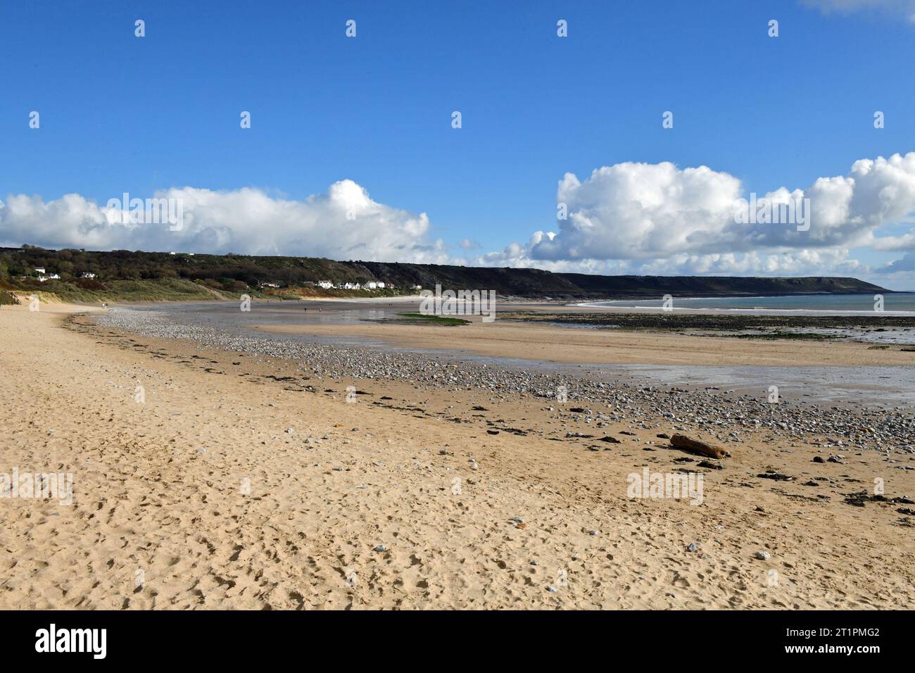 Following the curve of an empty Oxwich Beach around towards Three ...