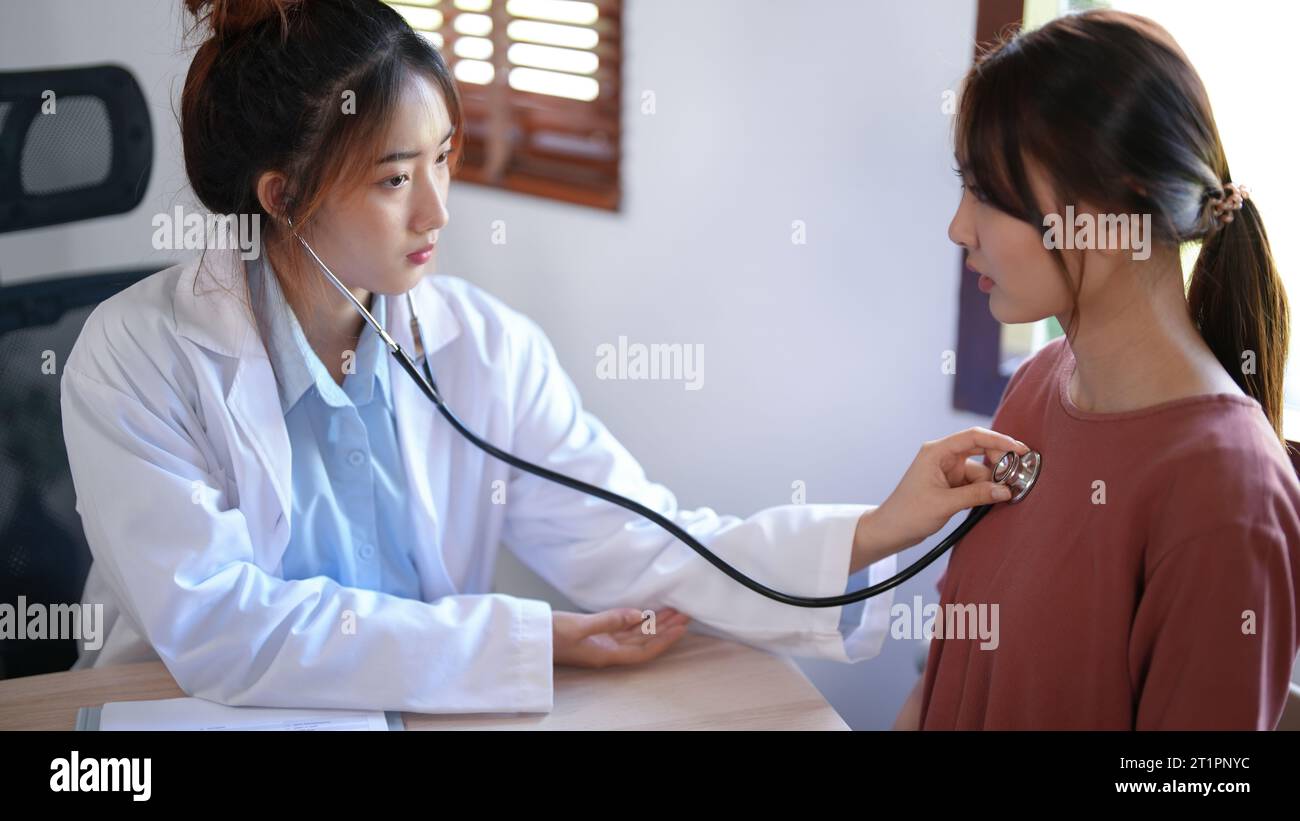 Asian psychologist women listening heartbeat of patient with ...