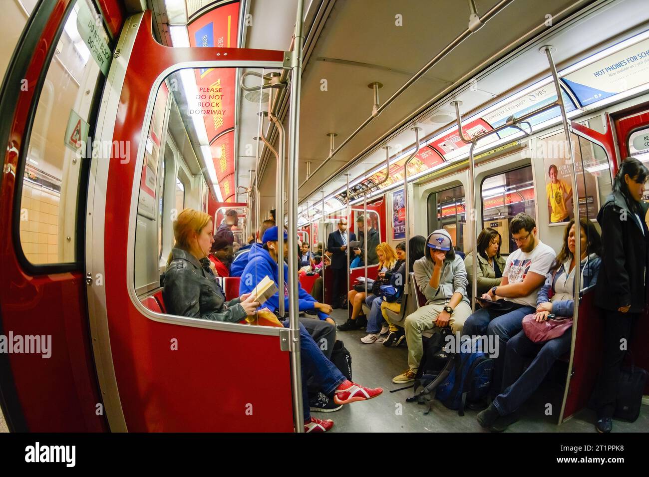 Wide-angle view of people commuters inside an old train belonging to ...
