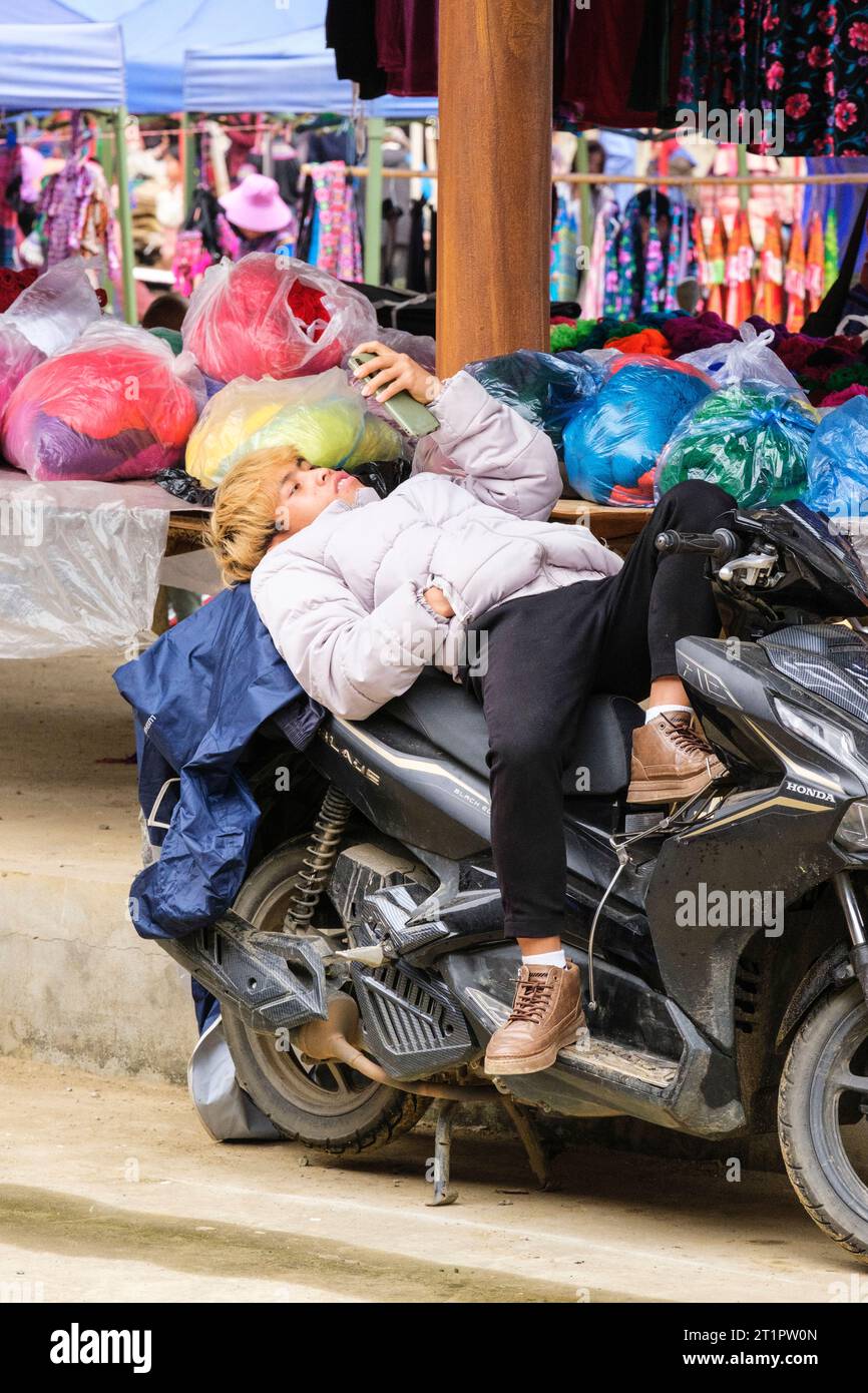 Can Cau Market Scene, Vietnam. Young Hmong Man Checking his Cell Phone ...