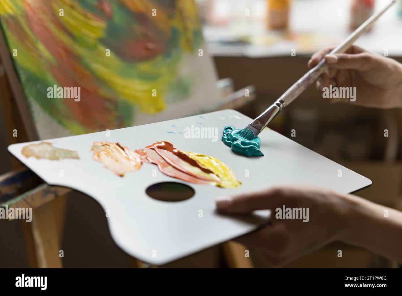 Creative process of talented woman painter in professional personal ...