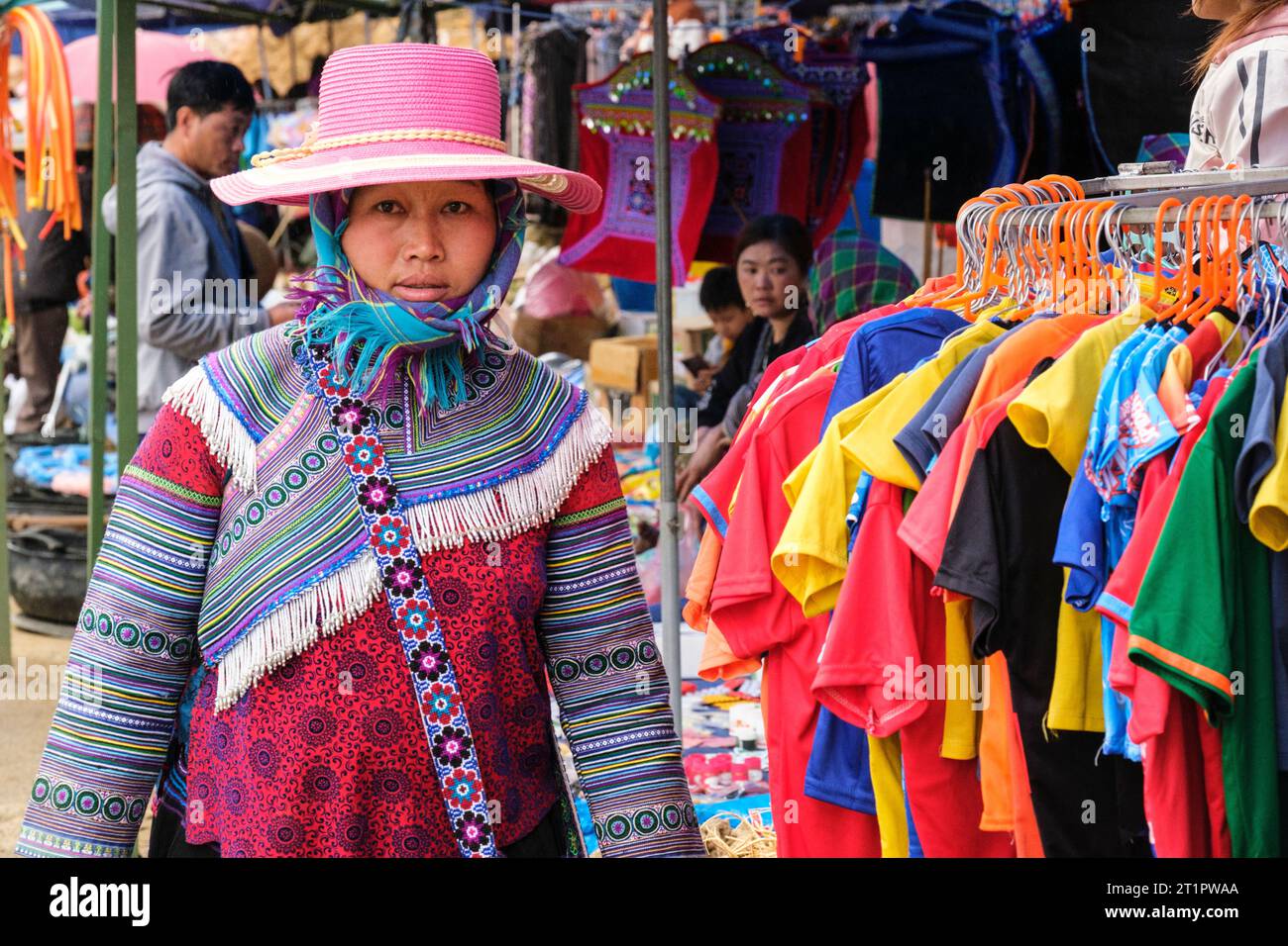 Can Cau Market Scene, Vietnam. Young Hmong Woman Walking by Rack of ...