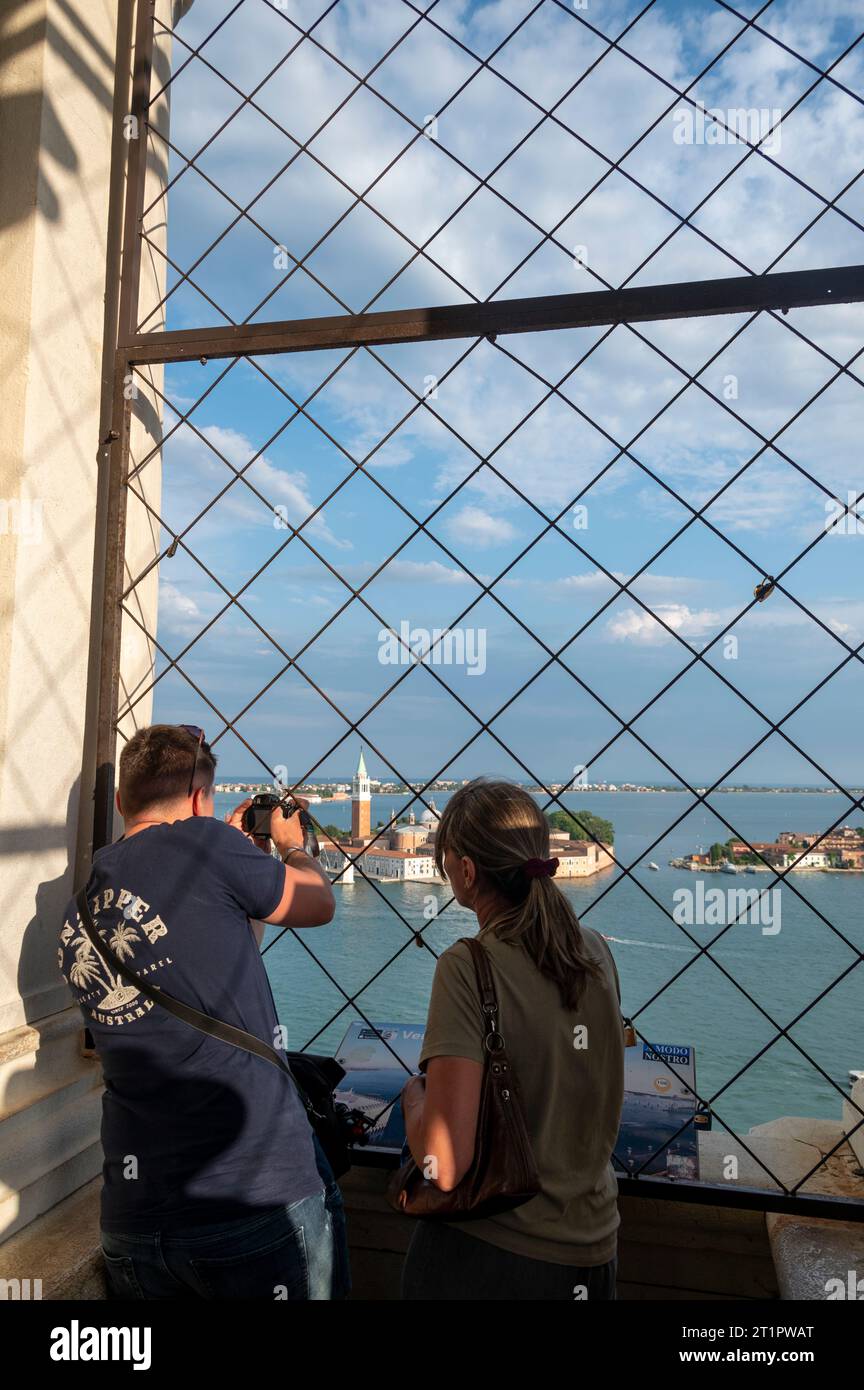 A young couple at the top of the 98.6 metres St Mark's Campanile in St ...
