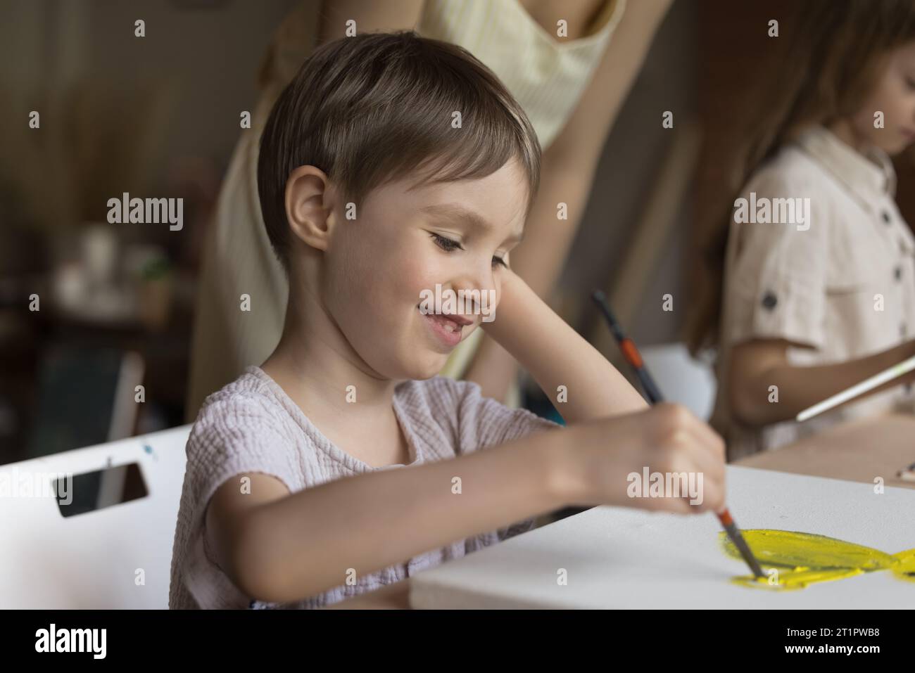 Cute little boy enjoys painting class, close up Stock Photo - Alamy