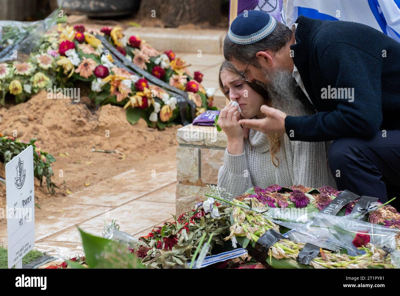 Jerusalem, Israel. 15th Oct, 2023. An Israeli young woman is comforted ...