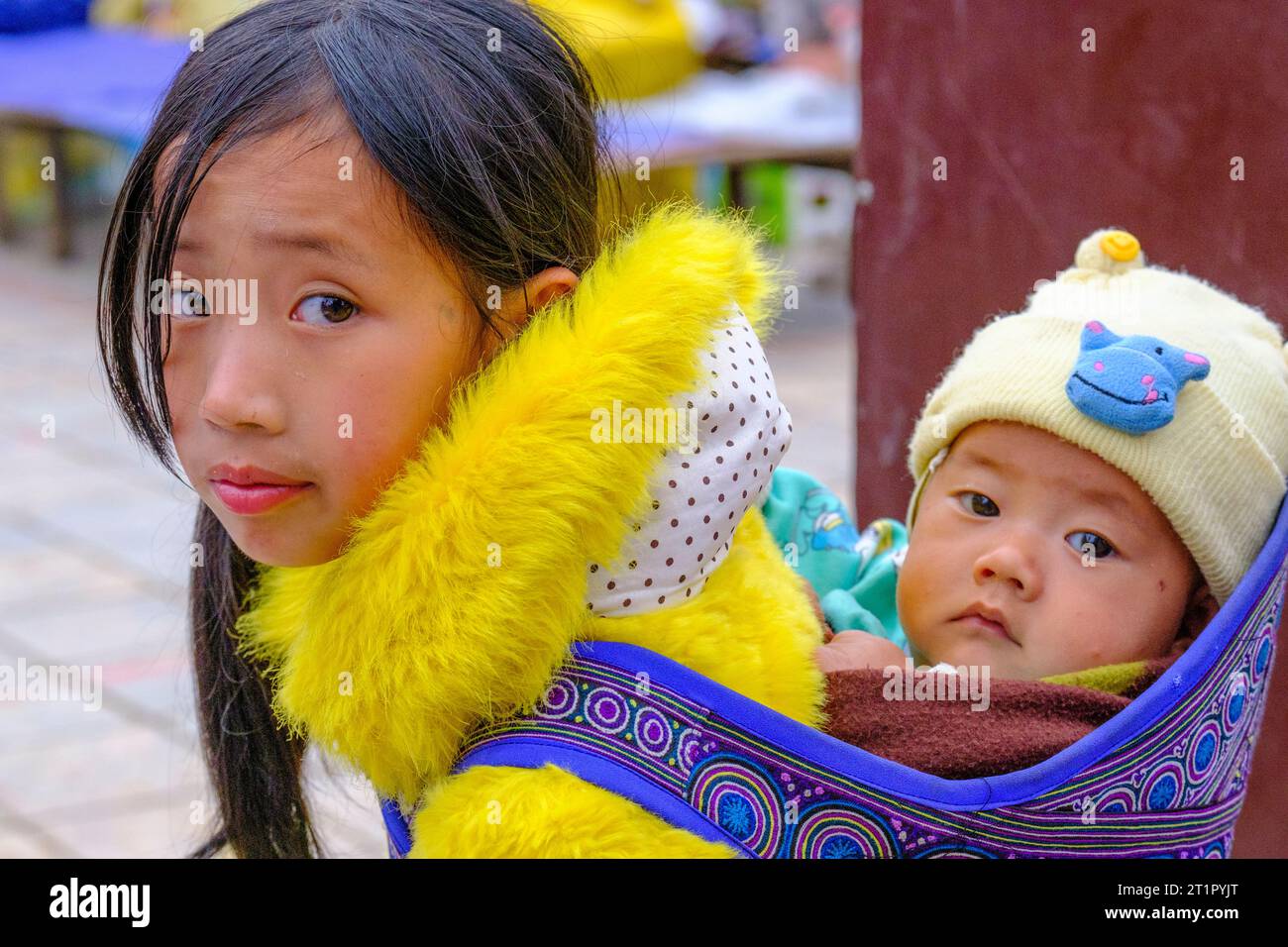 Bac Ha, Vietnam. Sunday Market Scene. Young Hmong Girl Carrying Infant ...