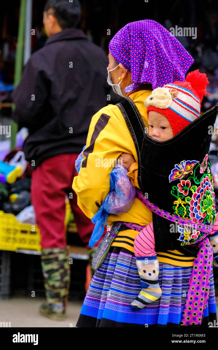 Bac Ha, Vietnam. Sunday Market Scene. Hmong Mother Carrying Baby on her ...