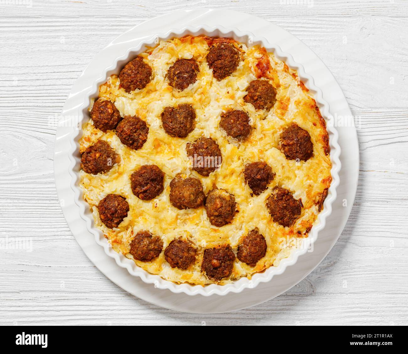 Meatball Hash Brown potato Casserole in baking dish on white wooden ...