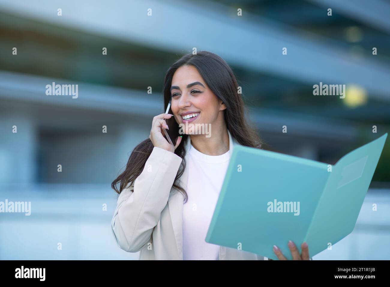 Smiling Lady Talking On Phone Holding Folder With Documents Outside ...