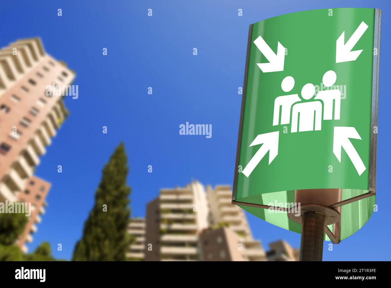 Emergency assembly point. Sign in a city against a clear blue sky. Sign ...