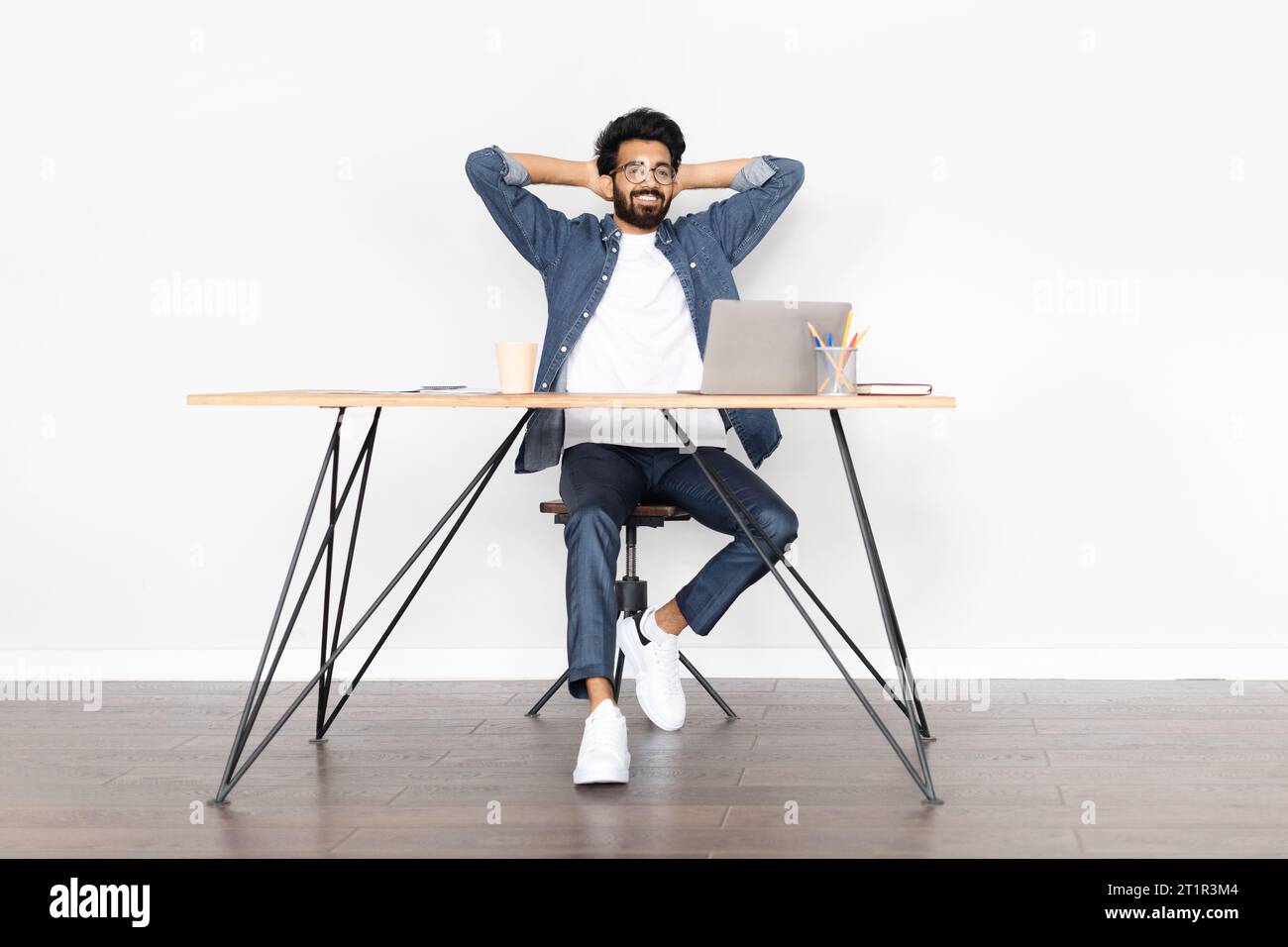Indian Guy Professional Enjoying Remote Work Setup Stock Photo - Alamy