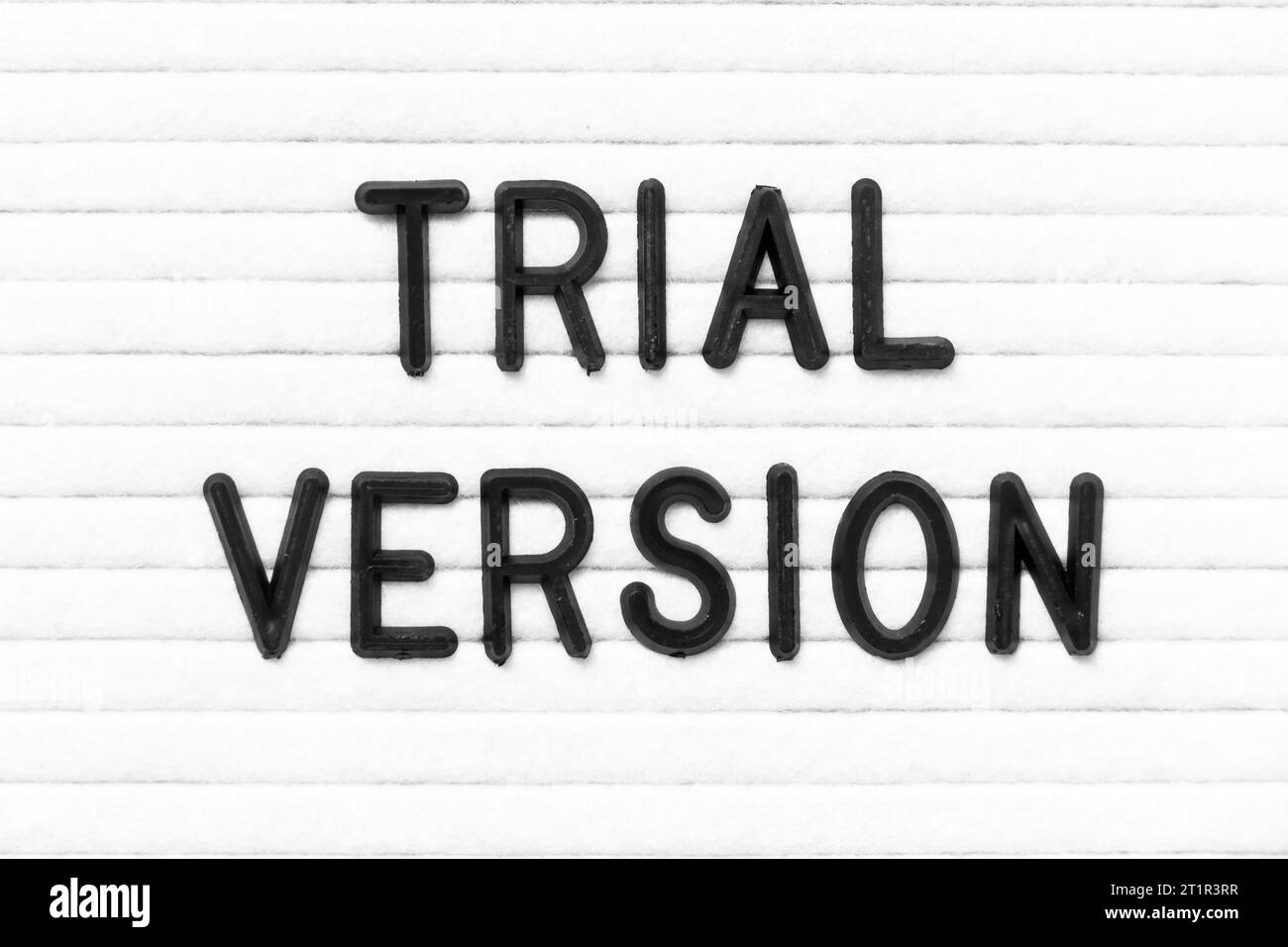 Black color letter in word trial version on white felt board background ...