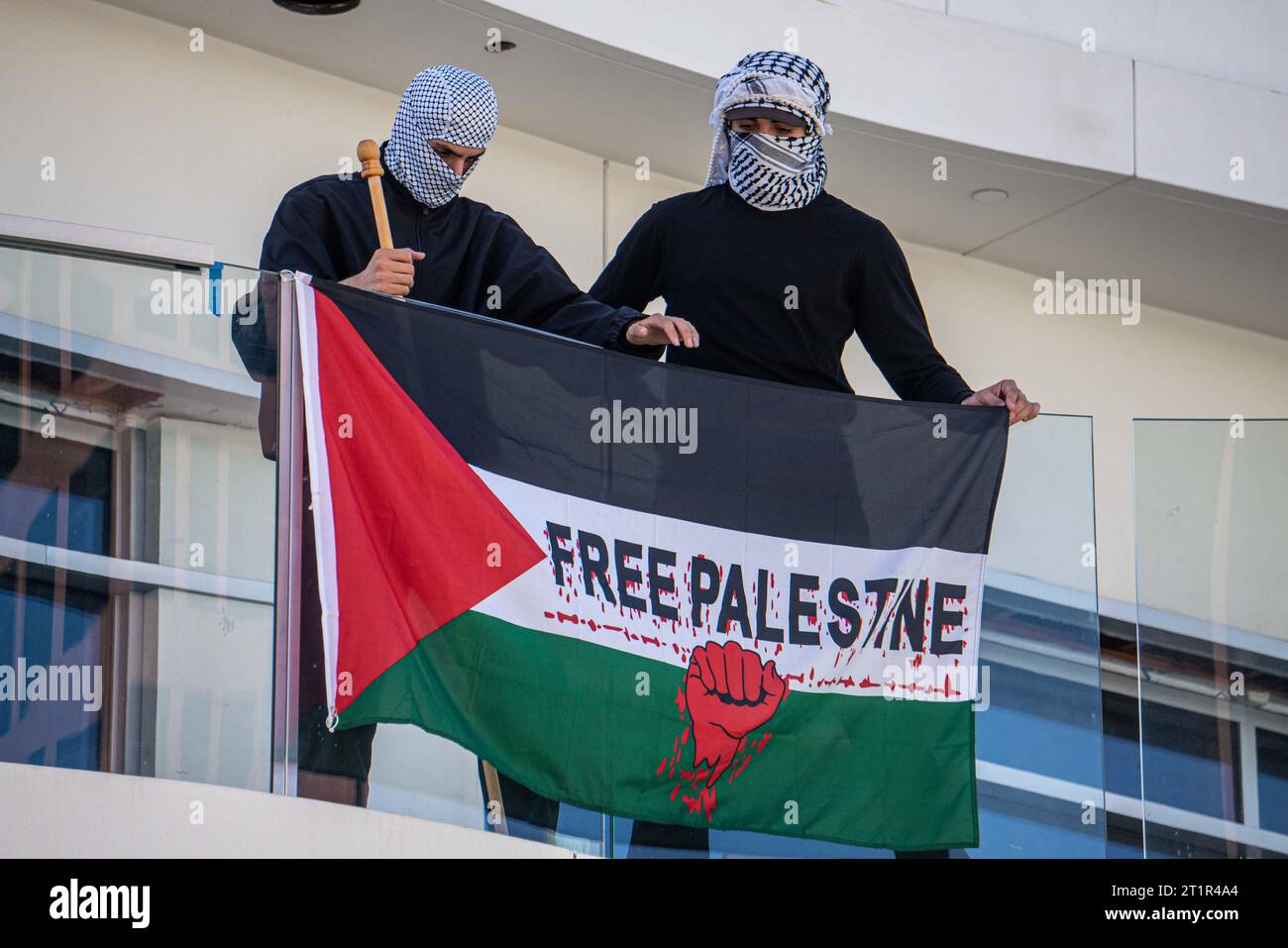 Los Angeles, USA. 14th Oct, 2023. Two supporters of Palestine display a ...