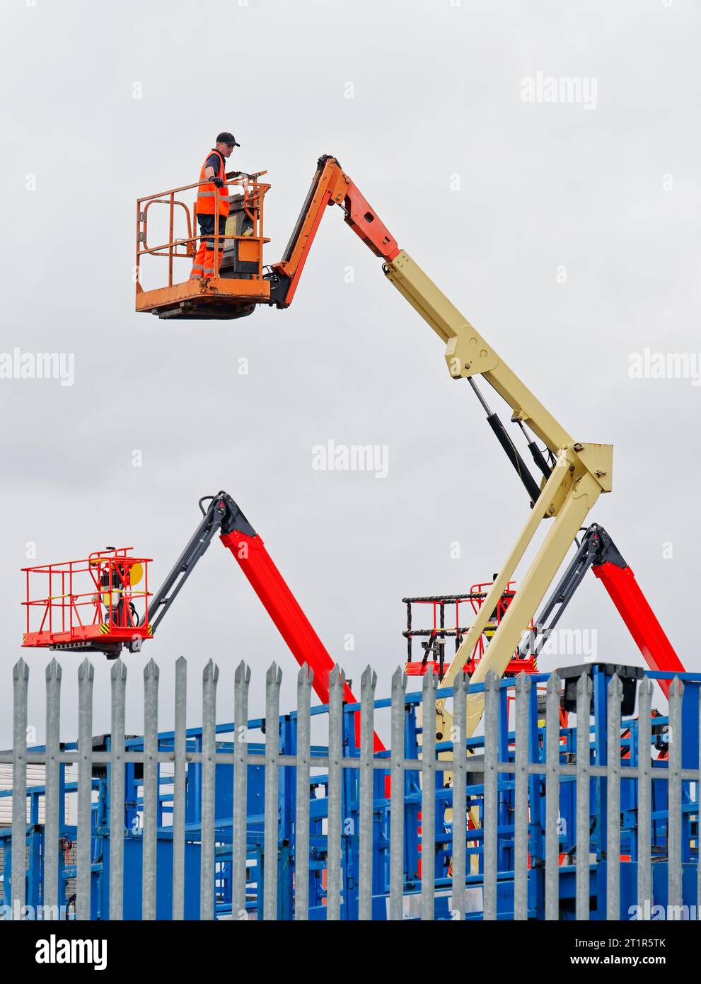 Access platform equipment powered high in sky at construction building ...