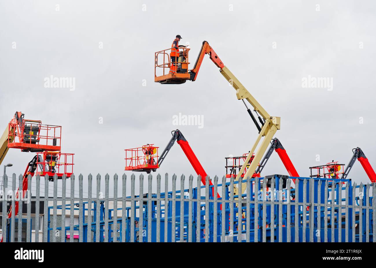 Access platform equipment powered high in sky at construction building ...