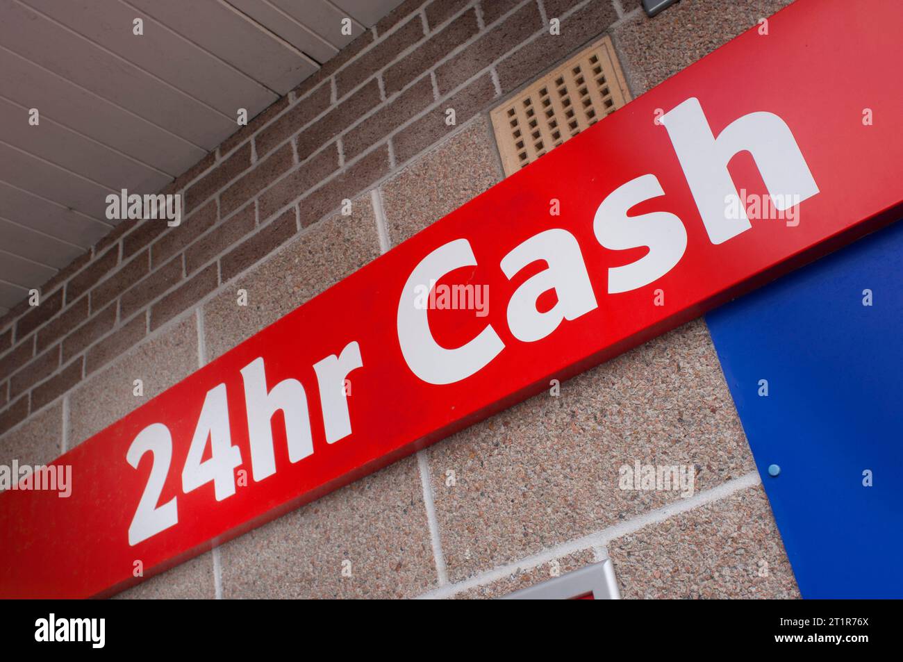 Red sign advertising a nearby ATM machine - John Gollop Stock Photo - Alamy