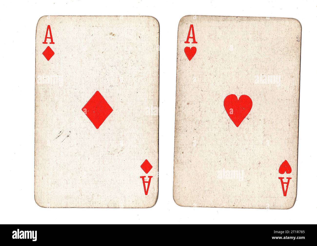 Vintage playing cards featuring a pair of red aces on a white ...