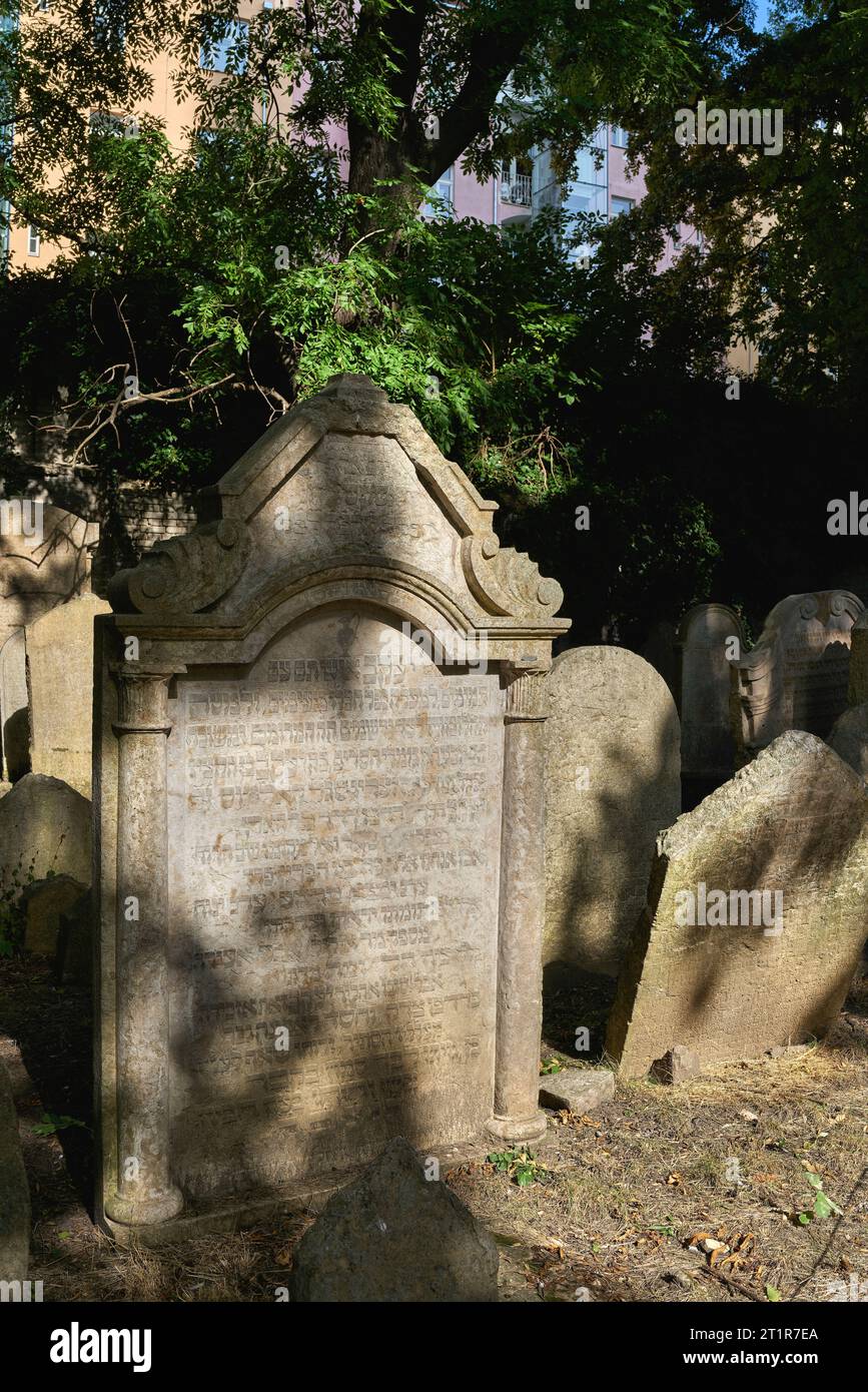 old weathered gravestones on a historical Jewish cemetery in Prague ...