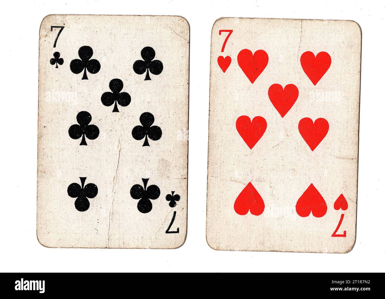 Vintage playing cards featuring a pair of sevens on a white background ...