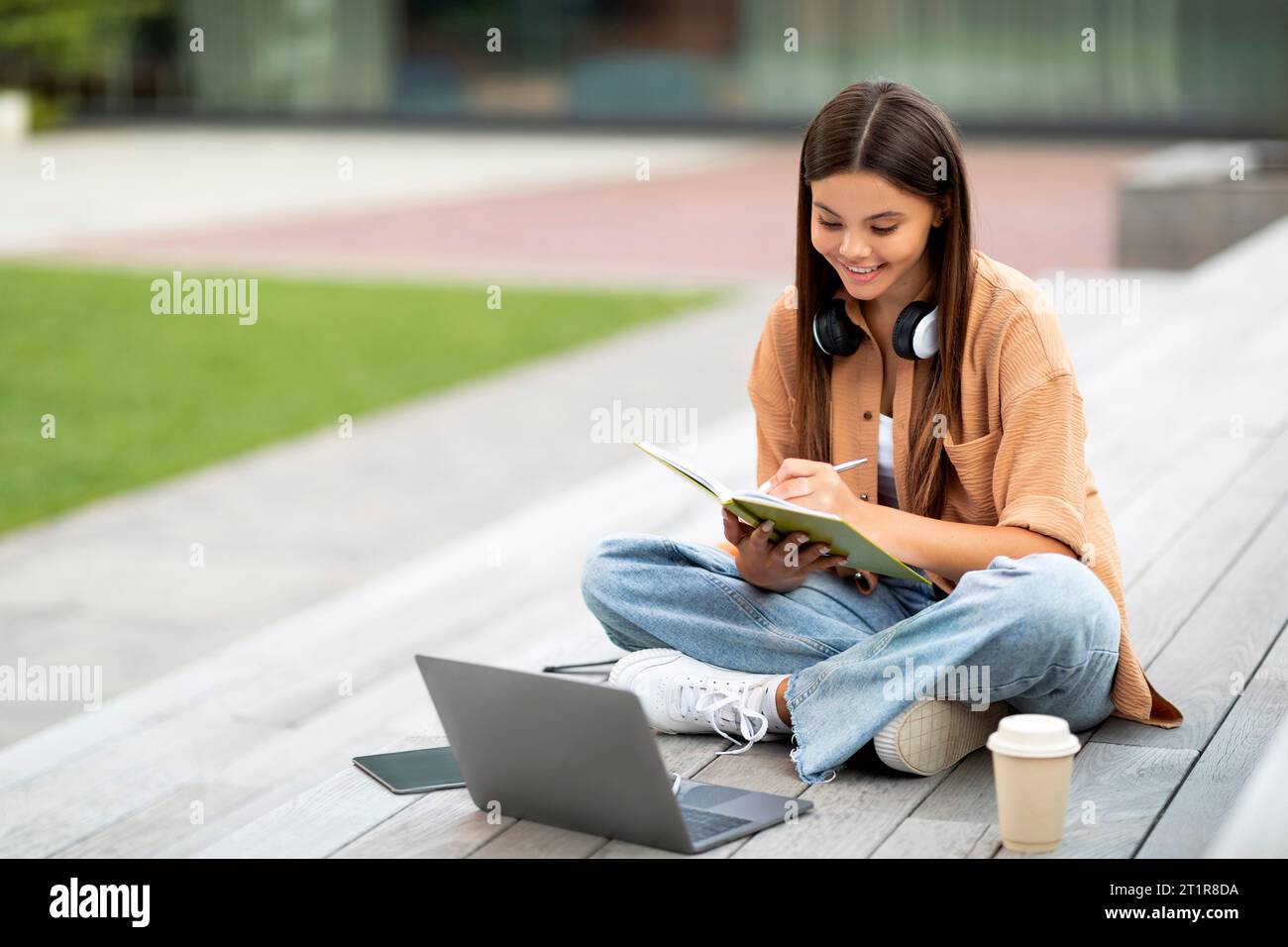 Content student using laptop outdoor, solitude university setting Stock ...