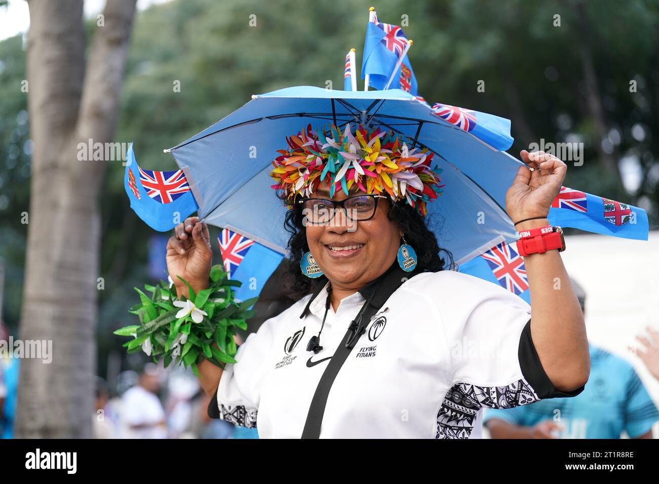 A Fiji fan wearing an umbrella hat near the stadium before the Rugby ...