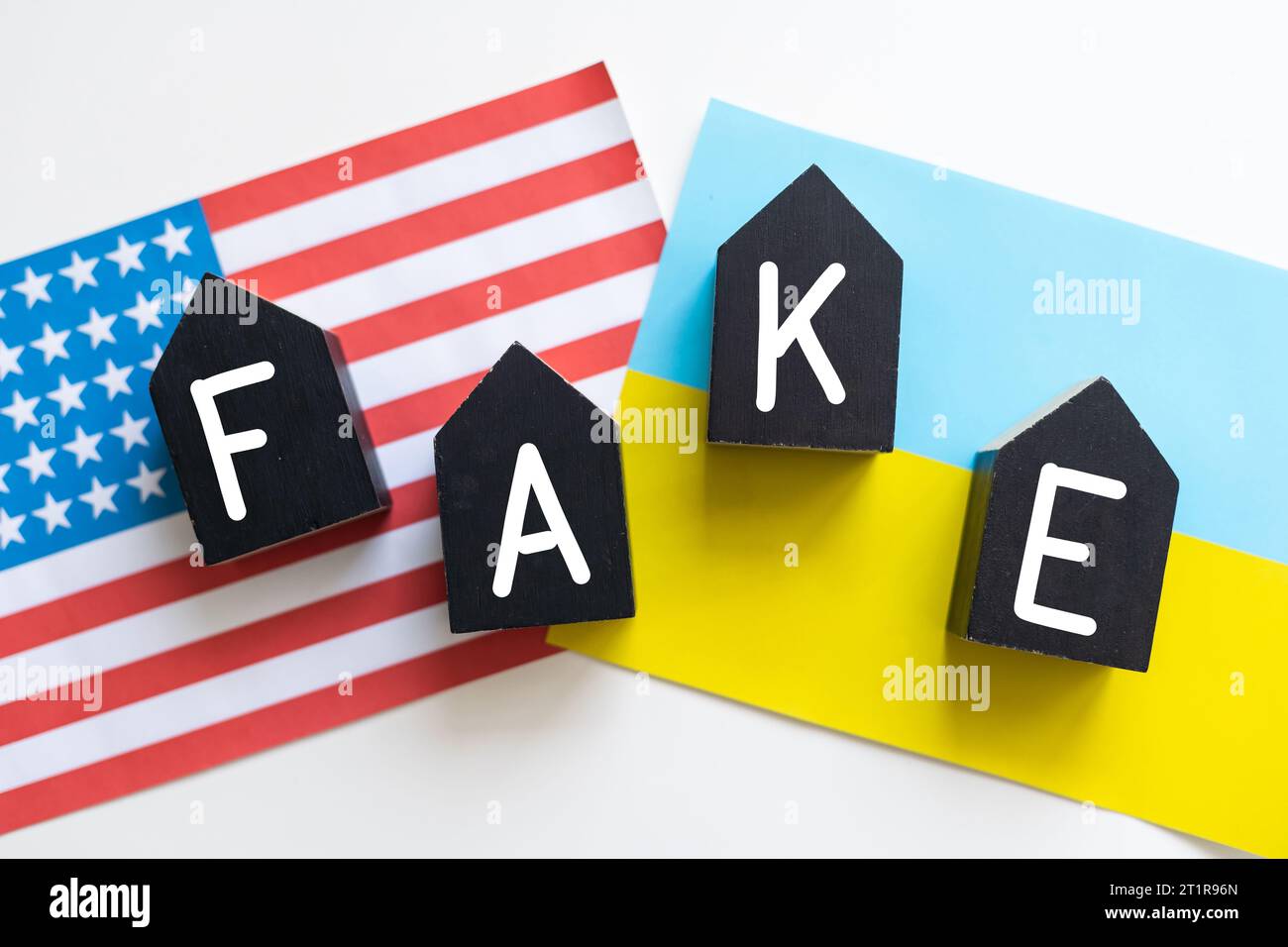A Fake News pin badge pictured over the flag of the United States of ...