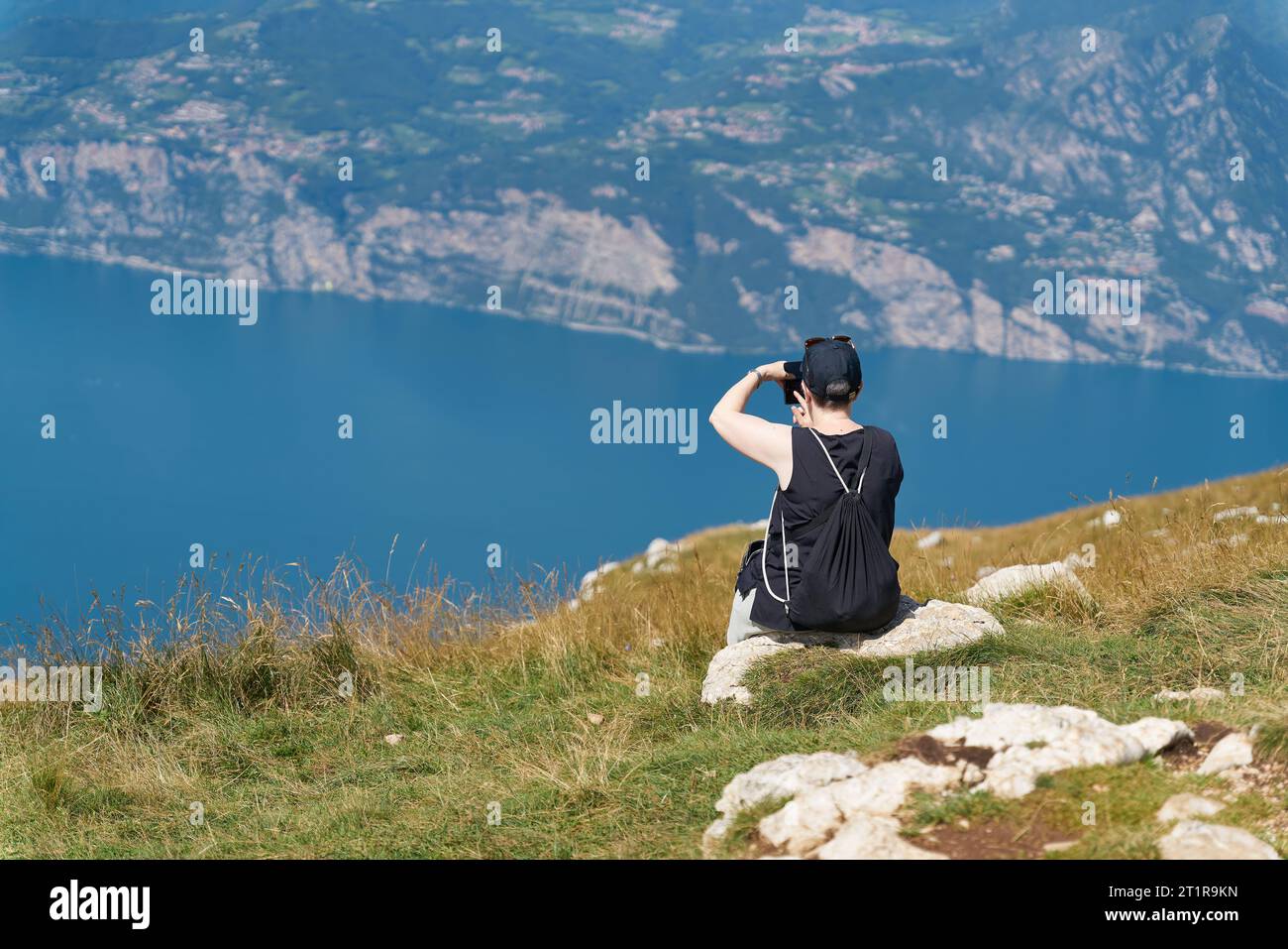 female Holidaymaker on the top of Monte Baldo on Lake Garda near ...