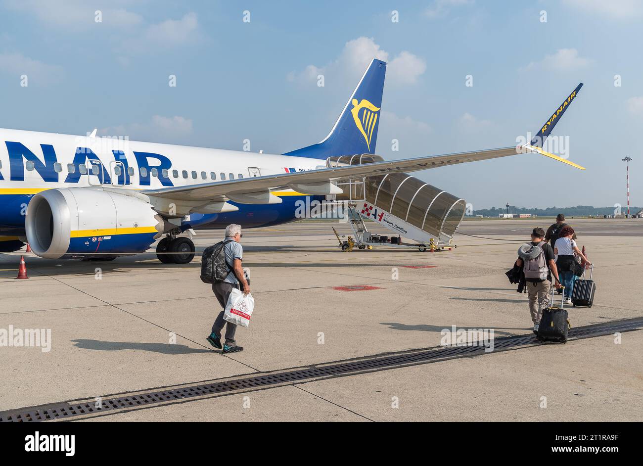 Ferno, Milan-Malpensa, Italy - October 3, 2023: Passengers boarding at ...