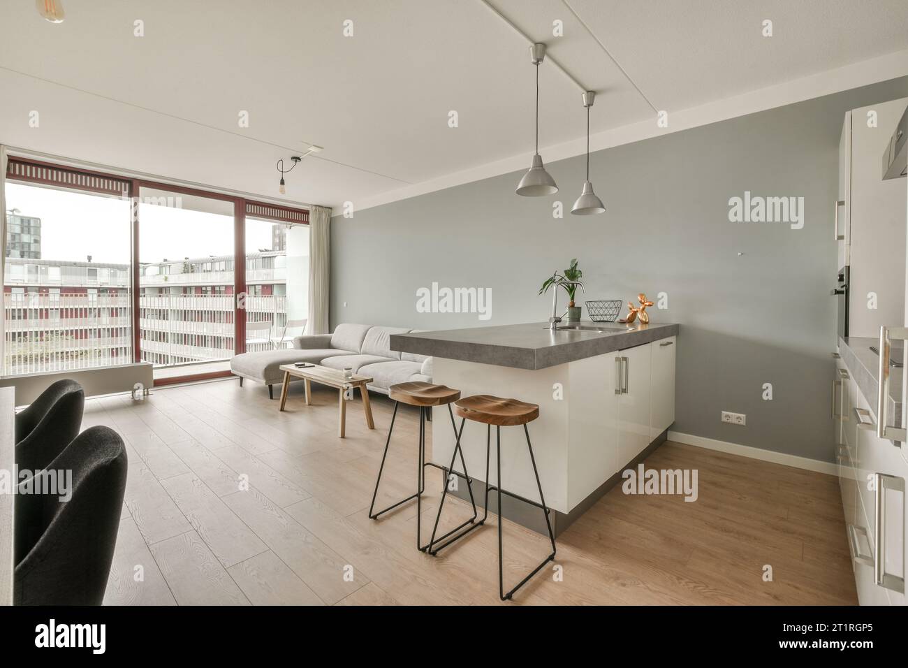 a kitchen and dining area in a condo apartment with wood floors, white ...