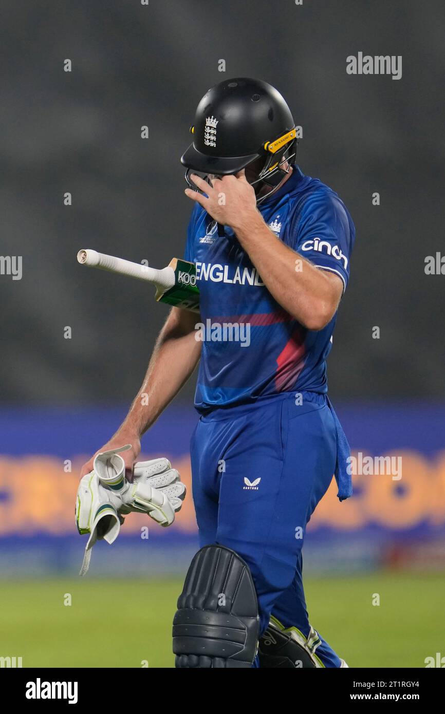 England's captain Jos Butler leaves the ground after losing his wicket ...