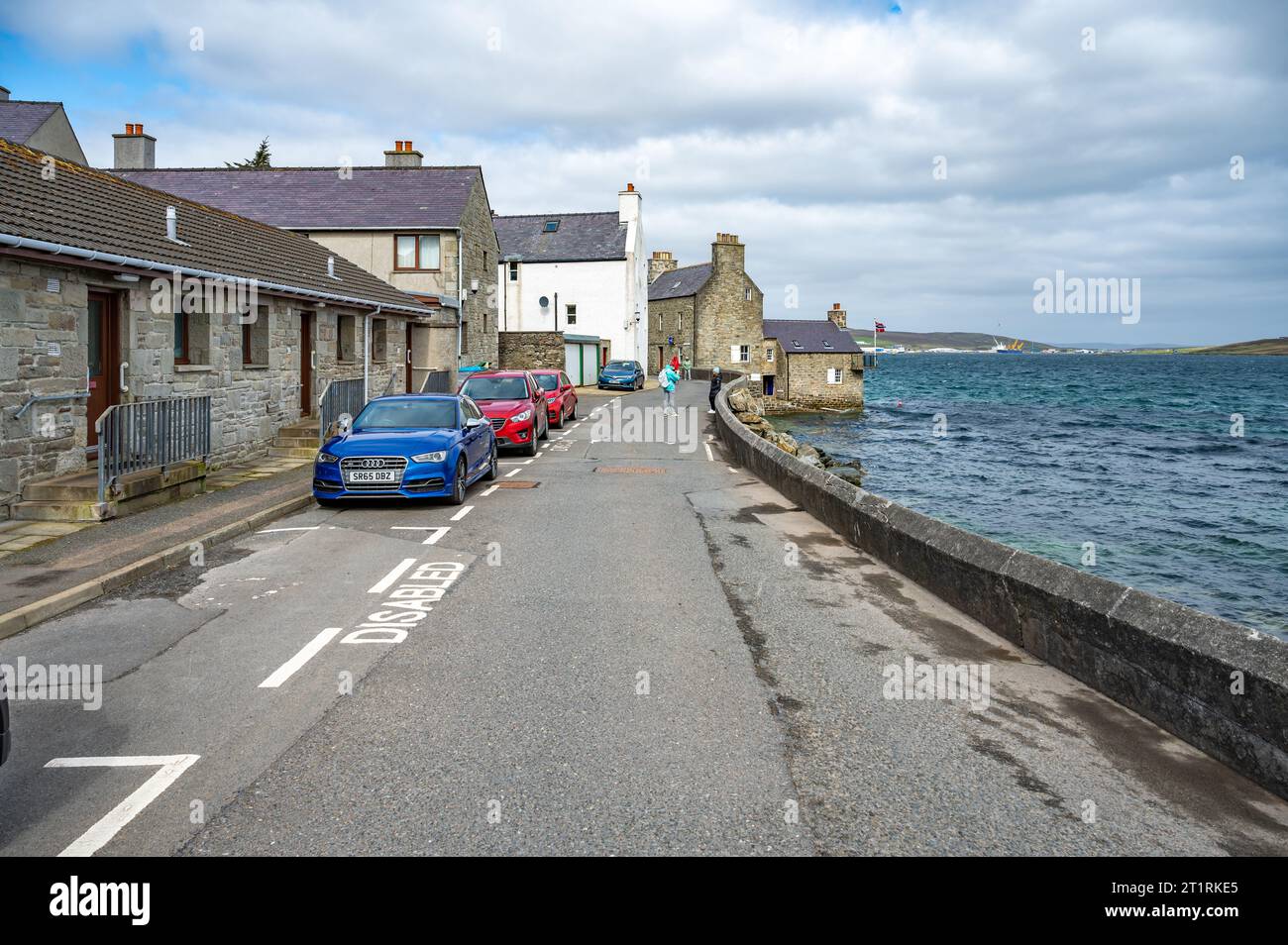 Disabled parking spot at a street near the sea at Shetland Island ...