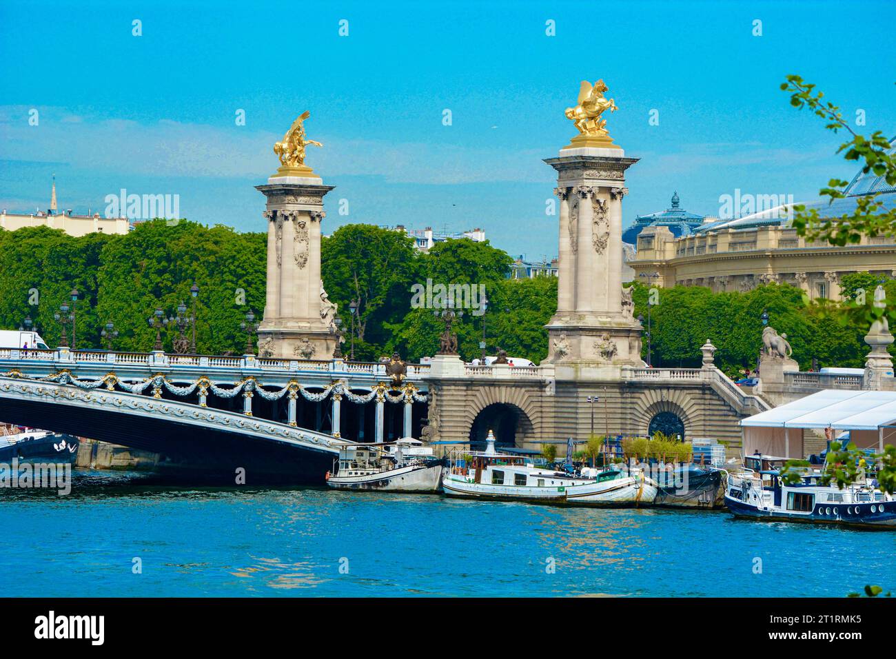 The charming Alexander III bridge in Paris France with gold sculptures ...
