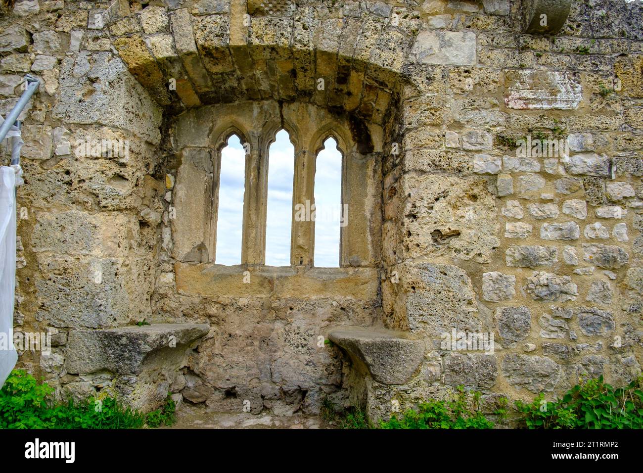 Gothic tracery windows in an old wall fragment, medieval castle ruins ...