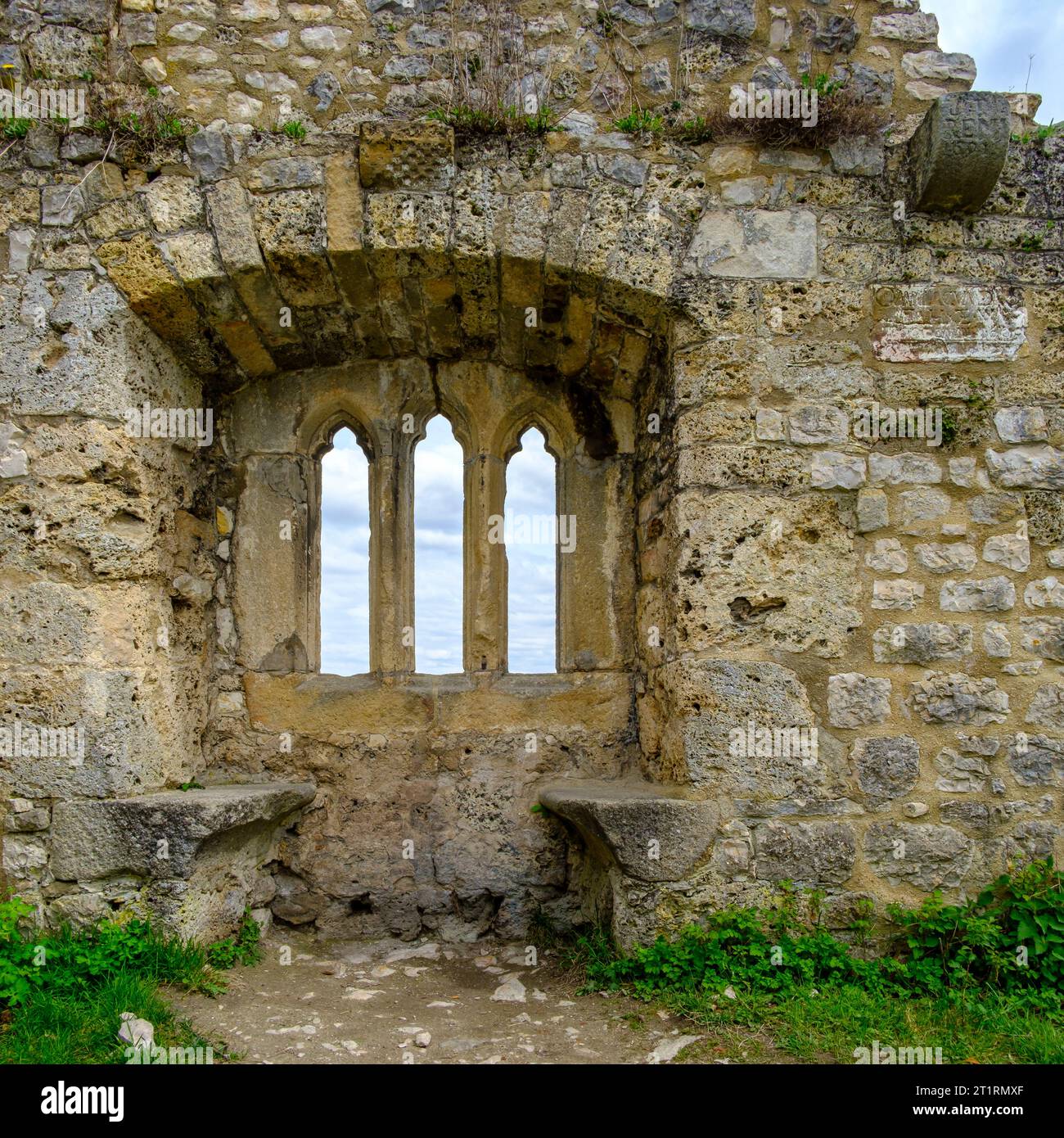 Gothic tracery windows in an old wall fragment, medieval castle ruins ...