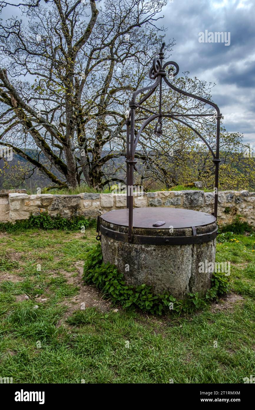 Historical well with cover made of wrought iron in the ruins of ...