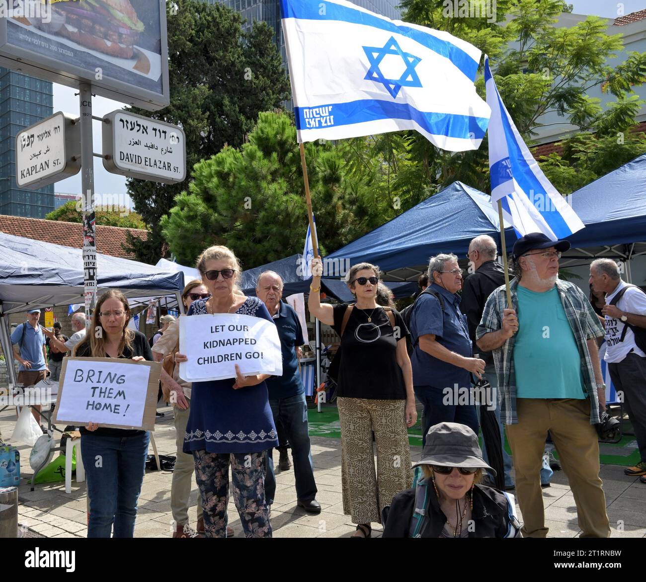 Tel Aviv, Israel. 15th Oct, 2023. Israelis with the national flag call ...