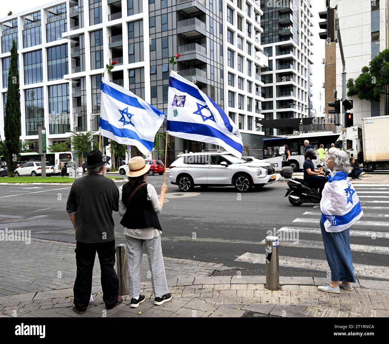 Tel Aviv, Israel. 15th Oct, 2023. Israelis with the national flag call ...