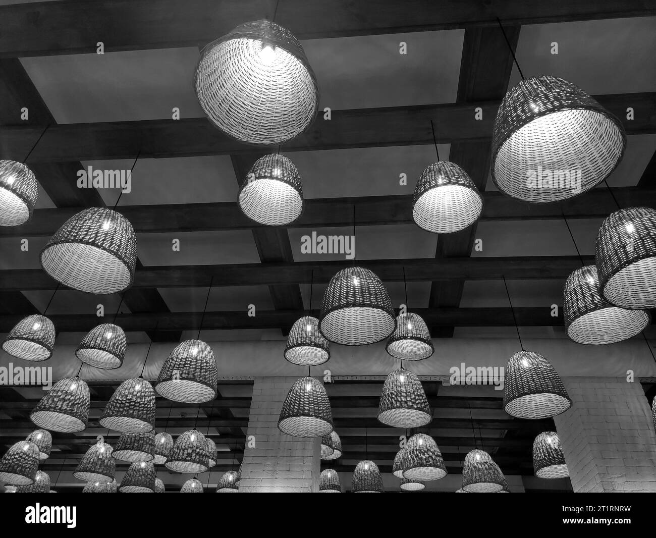 Black and white electric lamps and wooden ceiling background ...