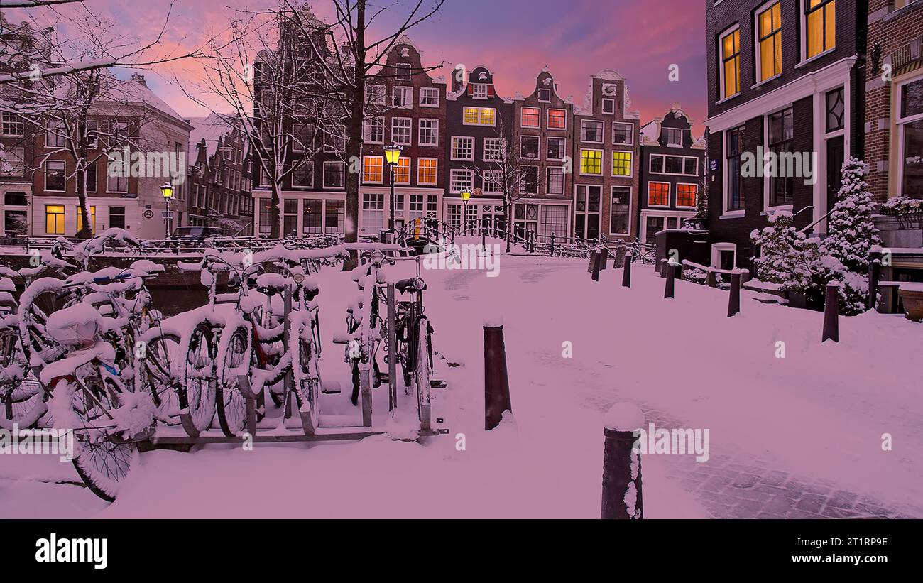 Snowy Amsterdam in the Netherlands at sunsert Stock Photo - Alamy