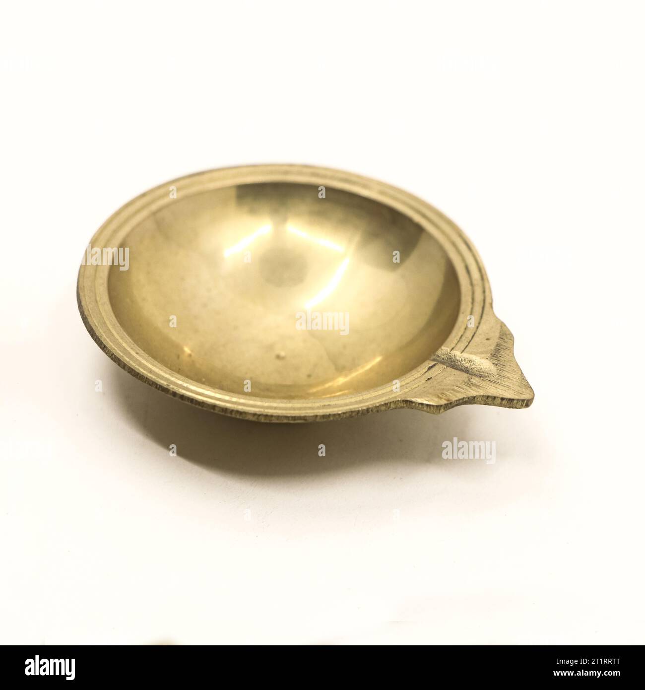 a traditional vintage diwali oil diya lamp in gold used for decorating ...