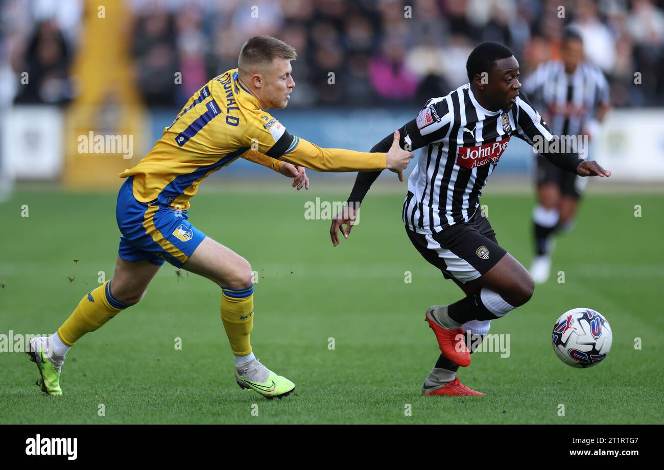 Notts County’s Aaron Nemane breaks past Mansfield Town’s Calum ...